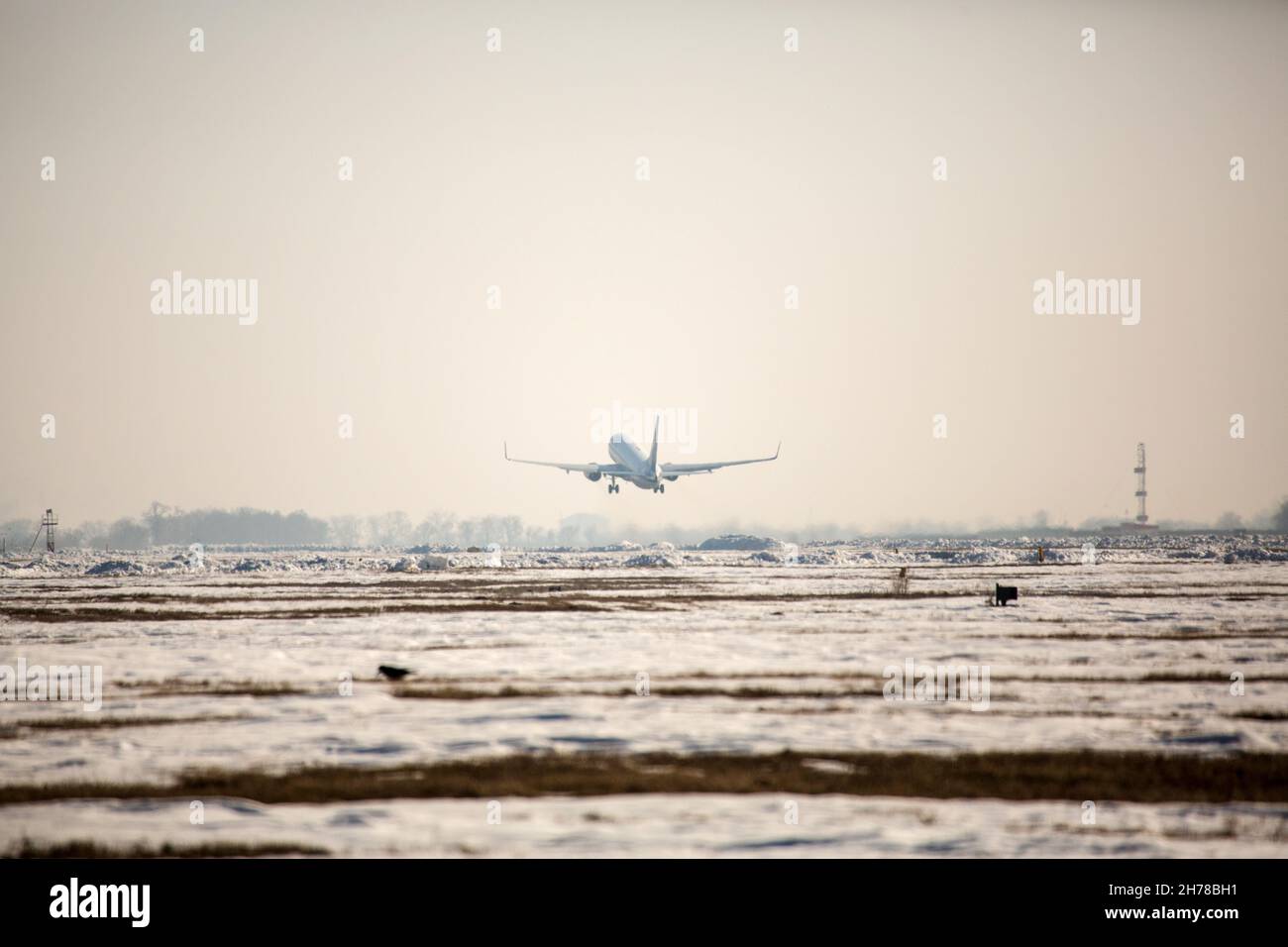 Passenger plane at airport in winter afternoon. plane on airport ...