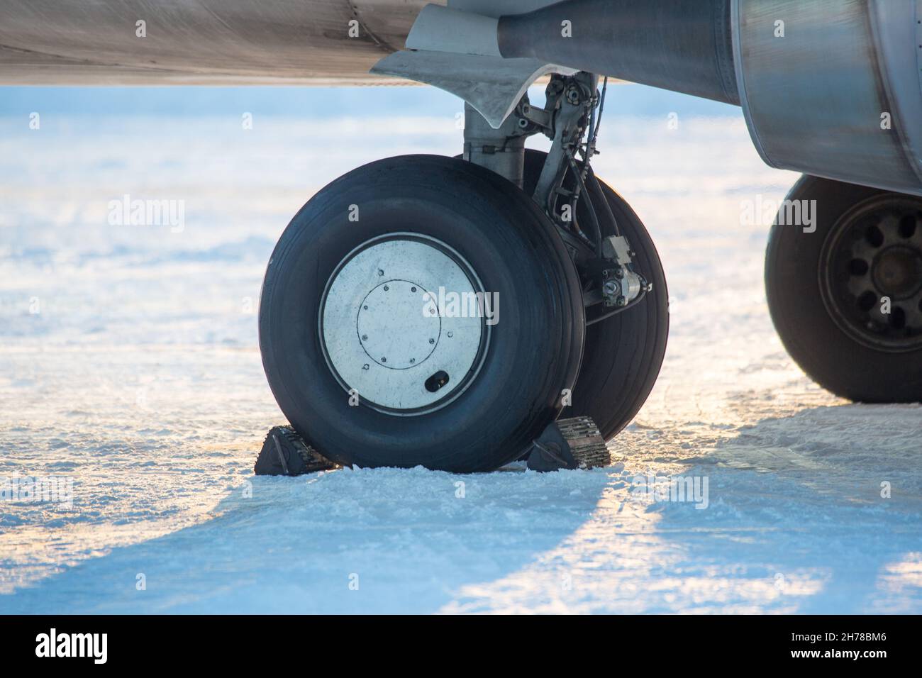 chassis airplane close-up in winter in snow. Close-up of chassis of ...