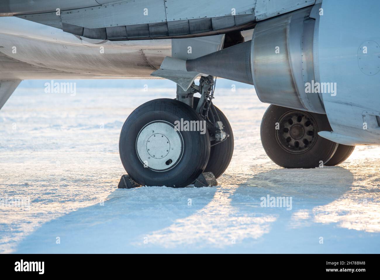 chassis airplane close-up in winter in snow. Close-up of chassis of ...