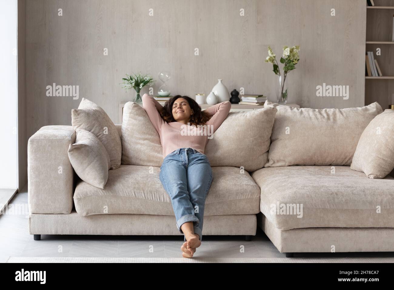 Barefoot girl lying on couch hi-res stock photography and images - Alamy