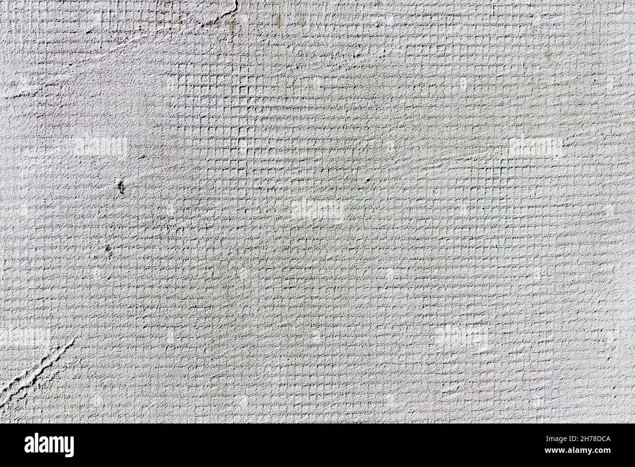 Plaster texture. Textured whitewash wall close-up with brush strokes ...