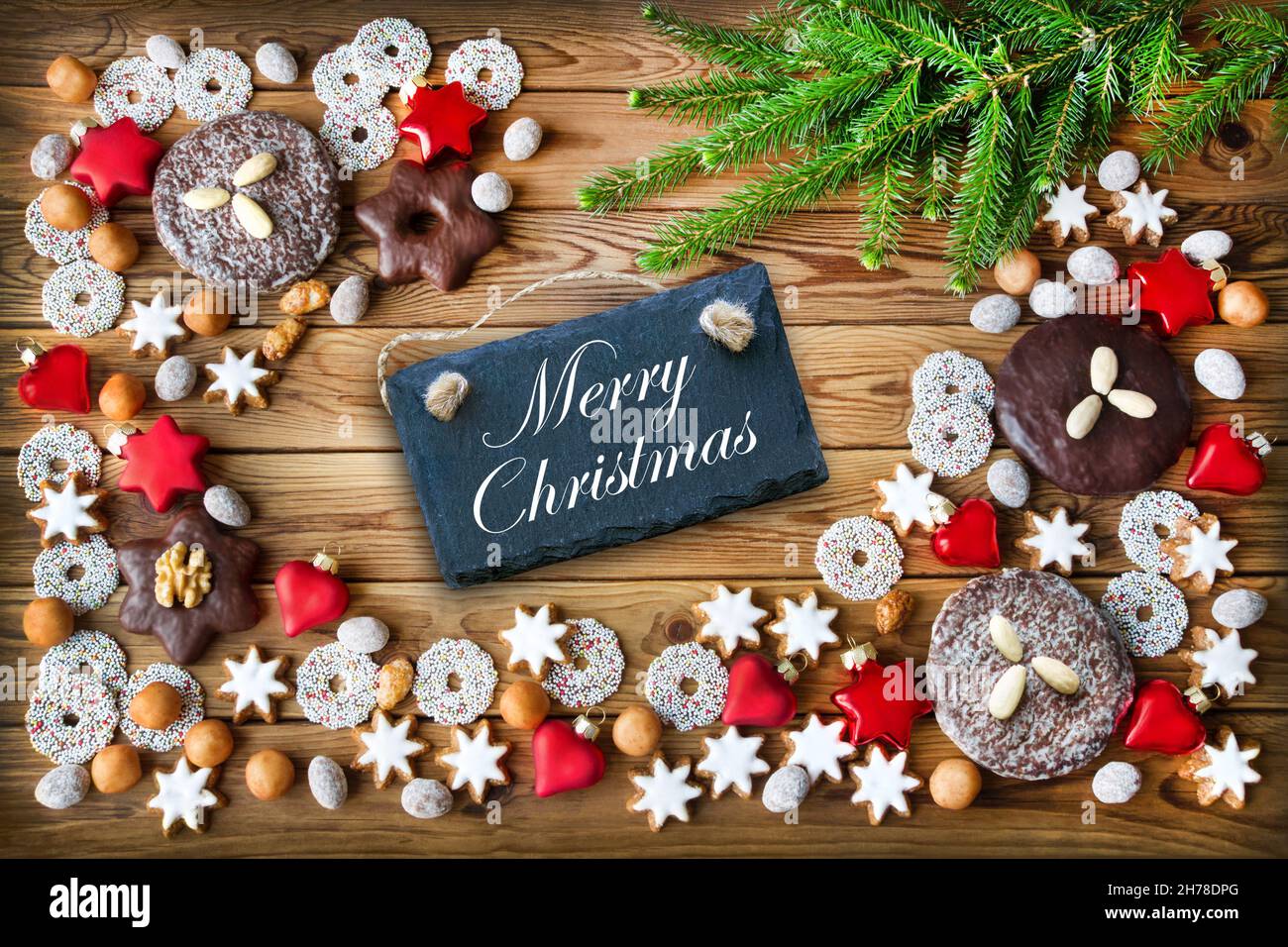 Merry Christmas label with decoration and sweets Stock Photo - Alamy