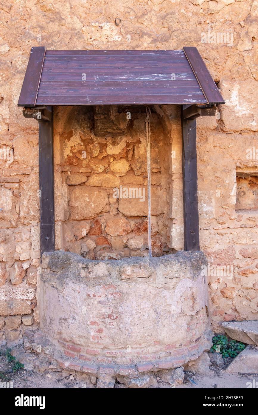 Old stone well with bucket hi-res stock photography and images - Alamy