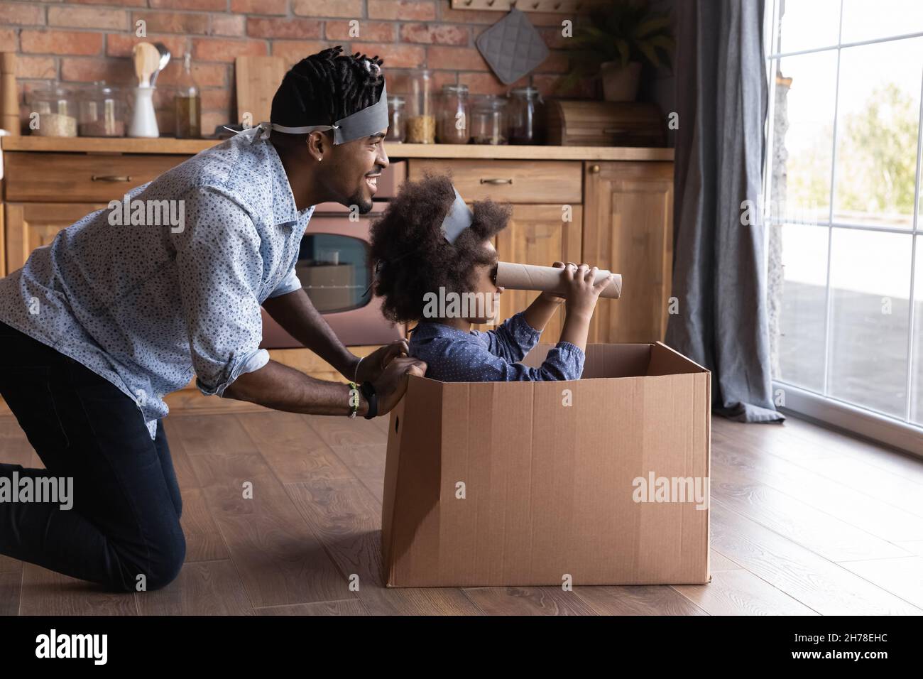 Happy family playing pirates game Stock Photo - Alamy