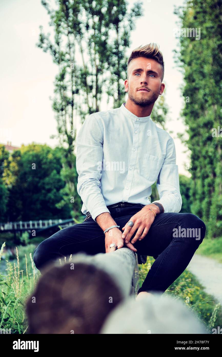 Man sitting on fence hi-res stock photography and images - Alamy