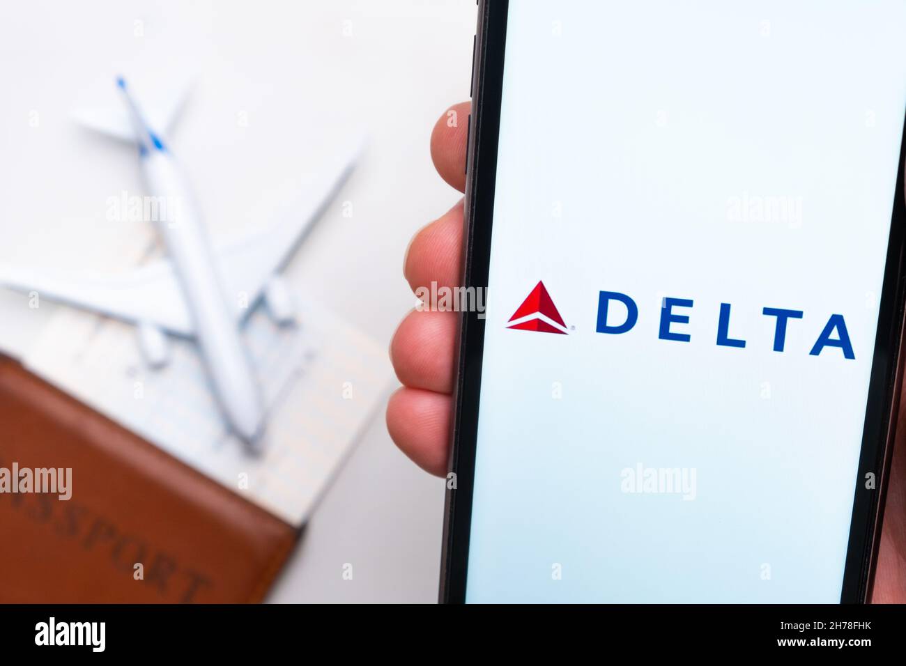 Delta Airline application on the screen of mobile phone in mans hand ...