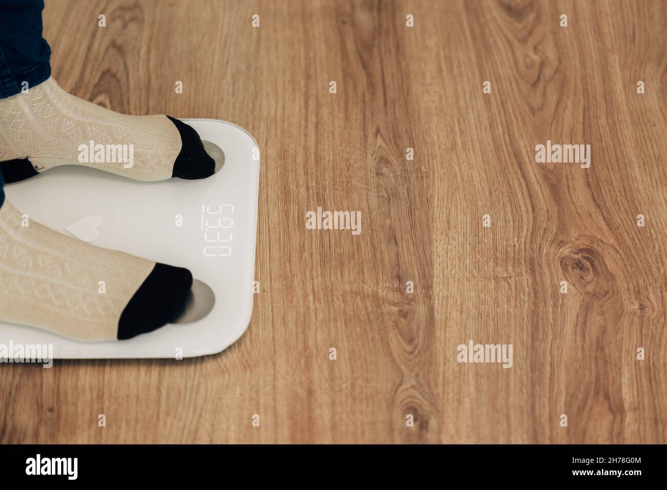 Girl Measures Weight on Smart Scales. Modern Electronic Device Stock ...