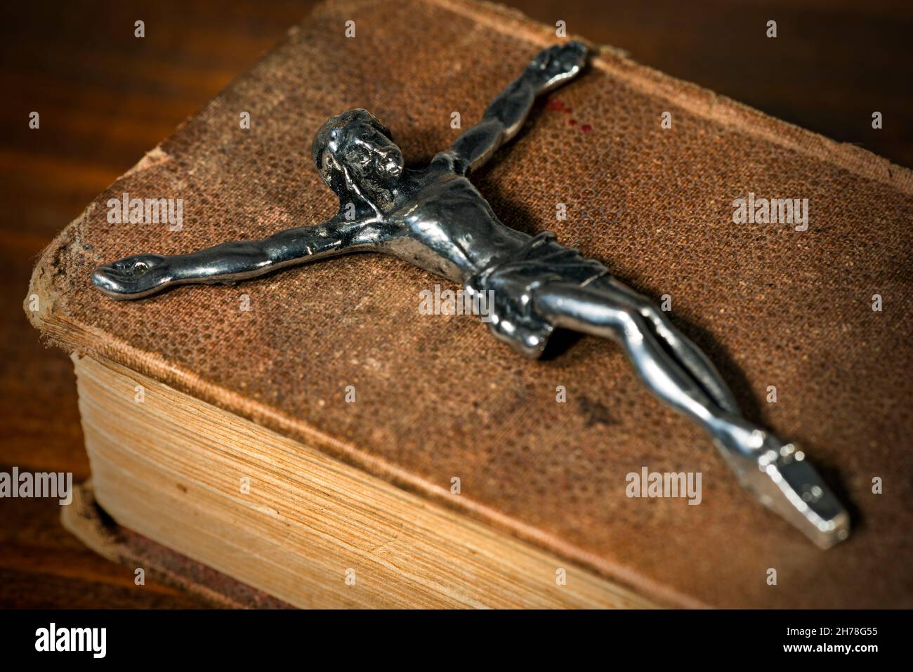 Close up of a silver crucifix without the cross on the cover of a old ...