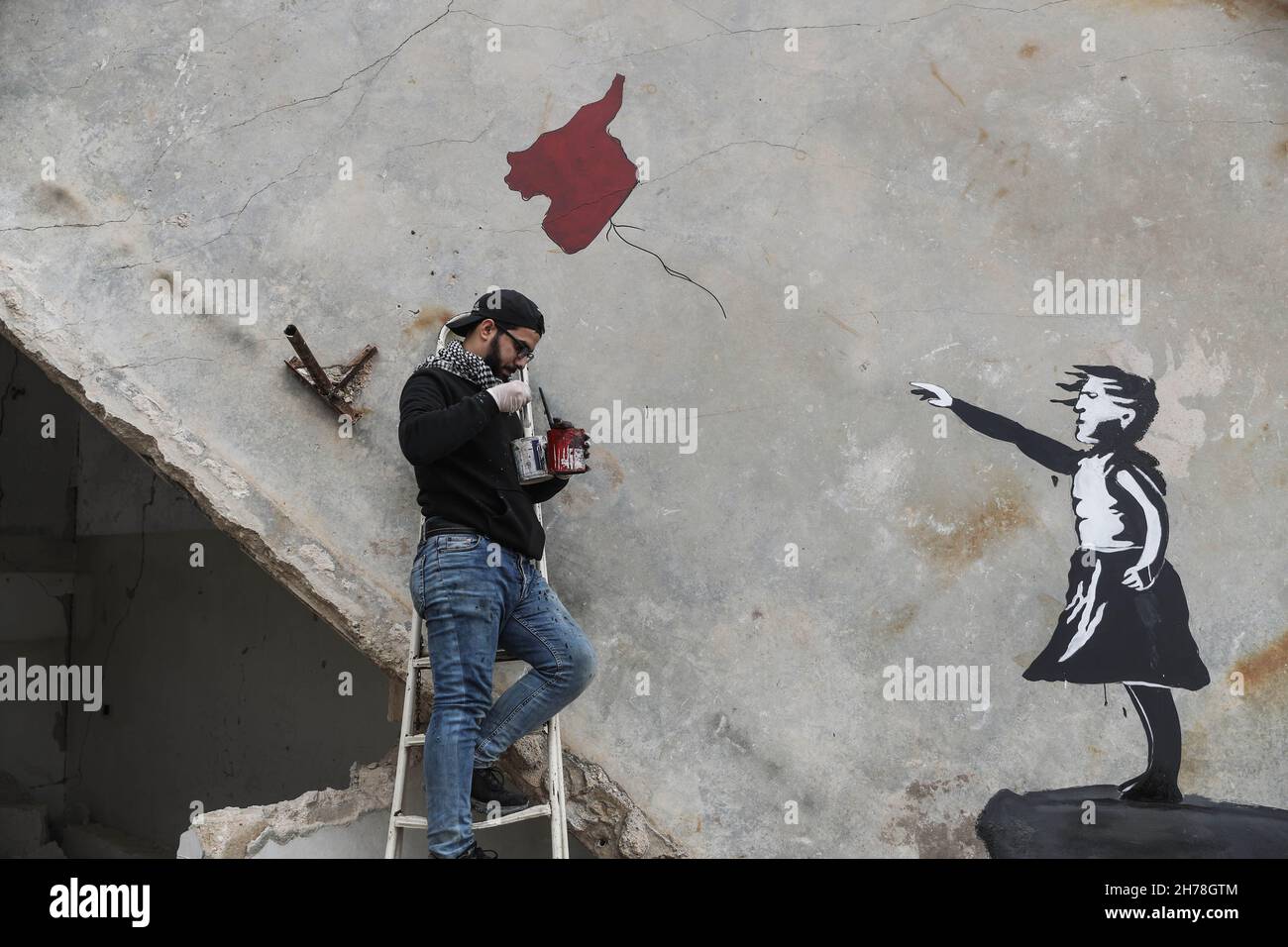 Al Nerab, Syria. 21st Nov, 2021. Syrian artist Abu Malik Al-Shami ...