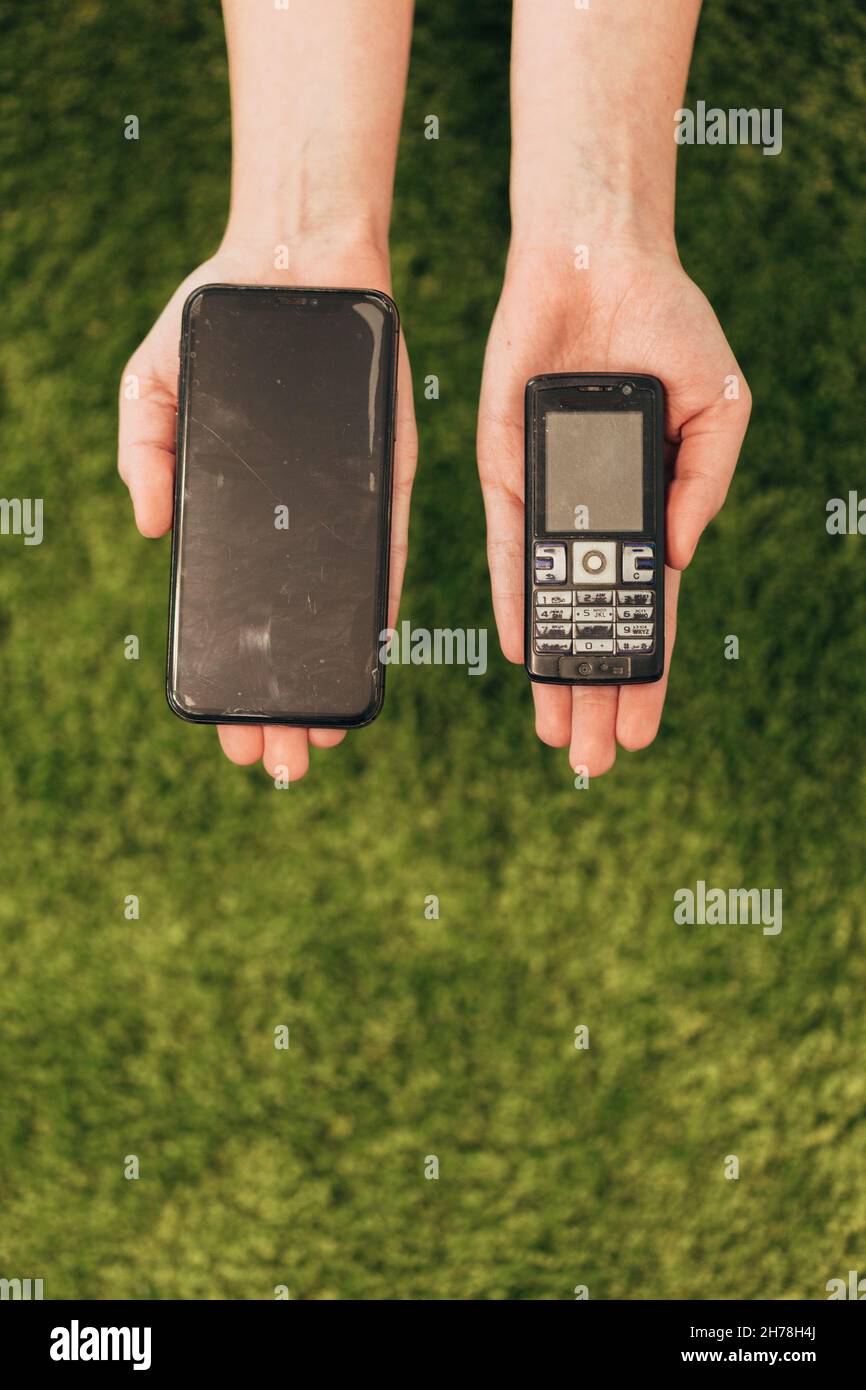 The Human Hand Choosing Phone That Lies Near New Smartphones Stock ...