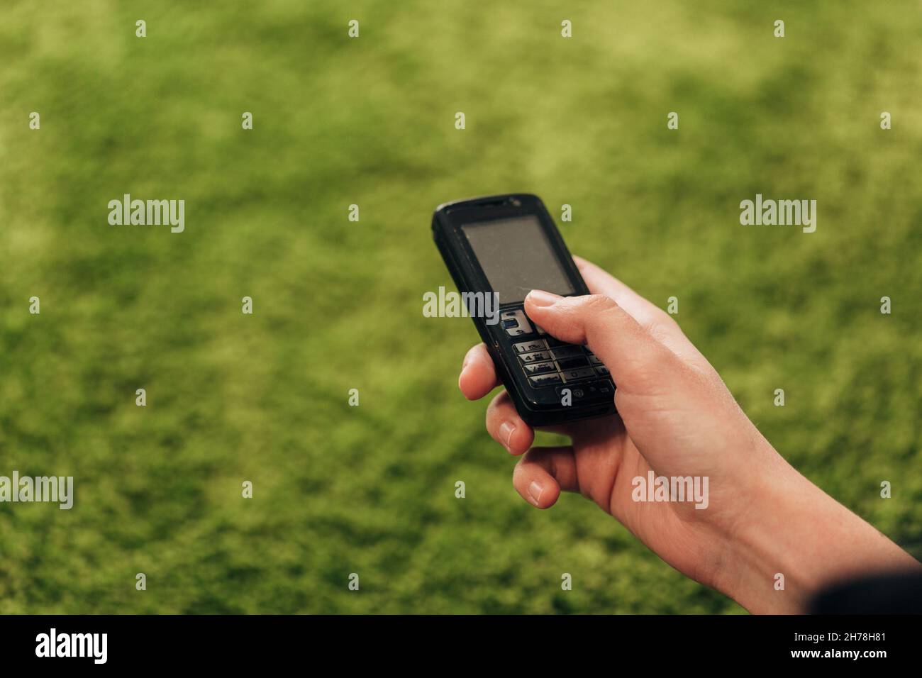 Girl Holds An Old Button Phone In Her Hand Stock Photo - Alamy