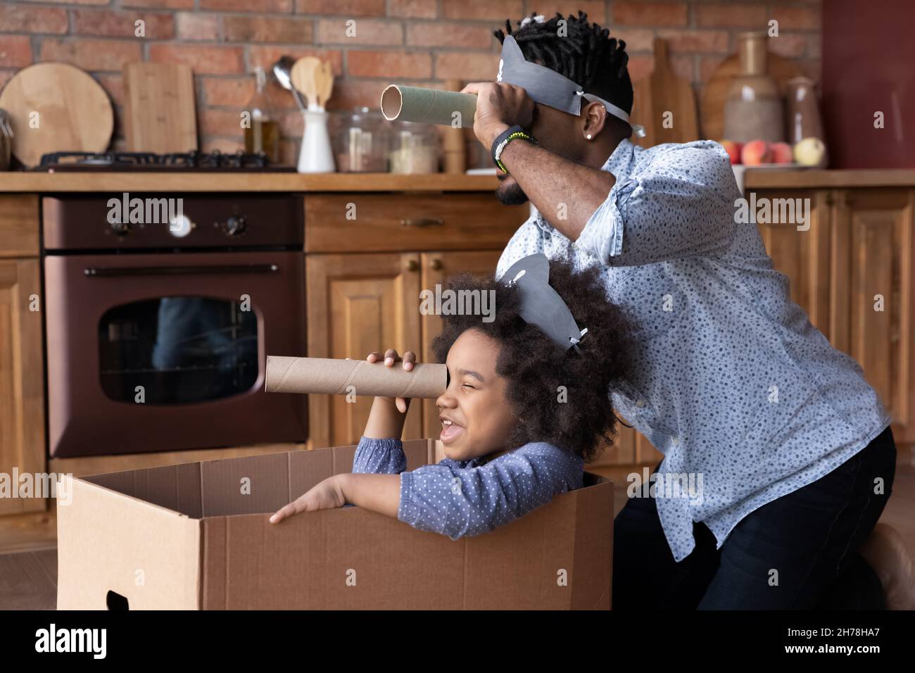 Happy family having fun at home Stock Photo - Alamy