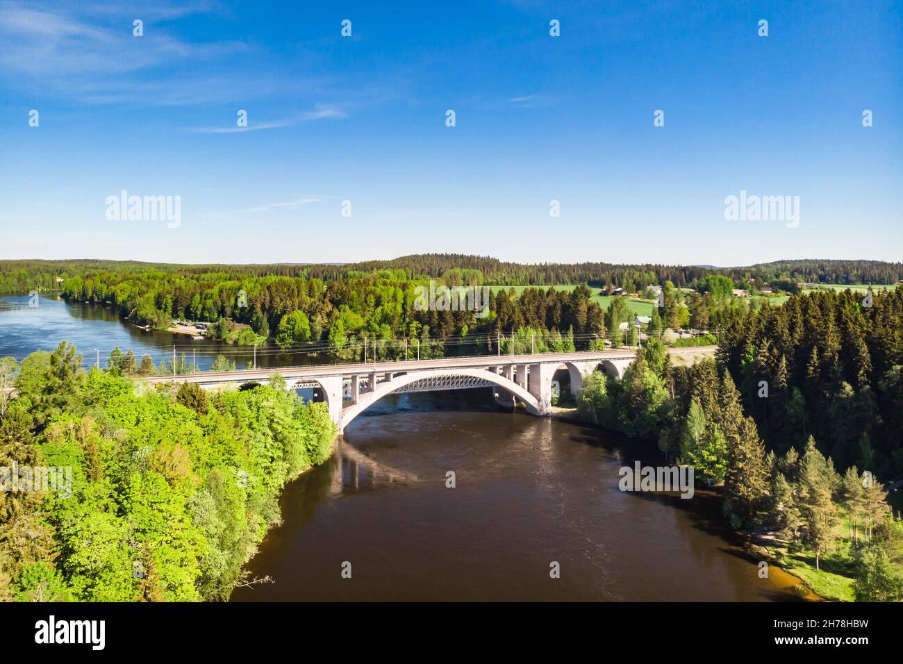 Summer aerial view of bridge and Kymijoki river waters in Finland ...