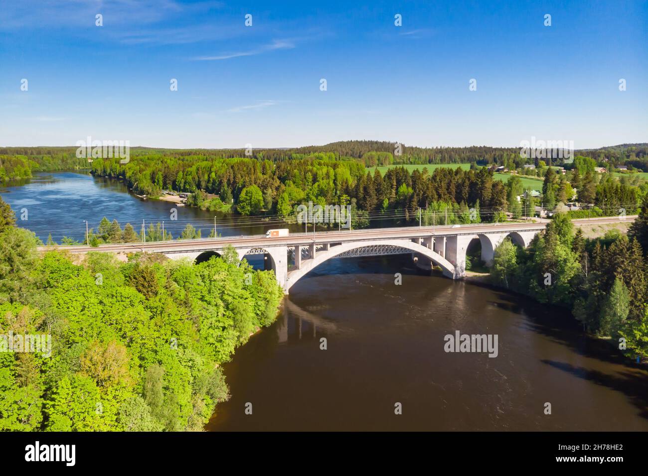 Summer aerial view of bridge and Kymijoki river waters in Finland ...