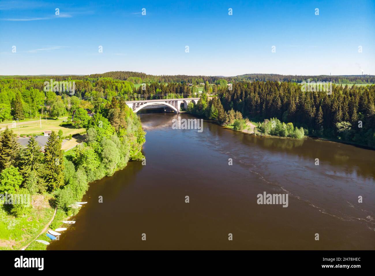 Summer aerial view of bridge and Kymijoki river waters in Finland ...