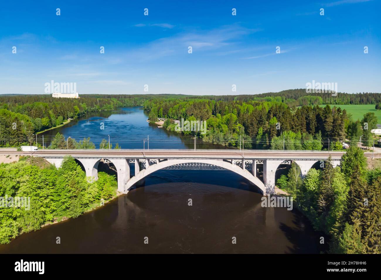 Summer aerial view of bridge and Kymijoki river waters in Finland ...