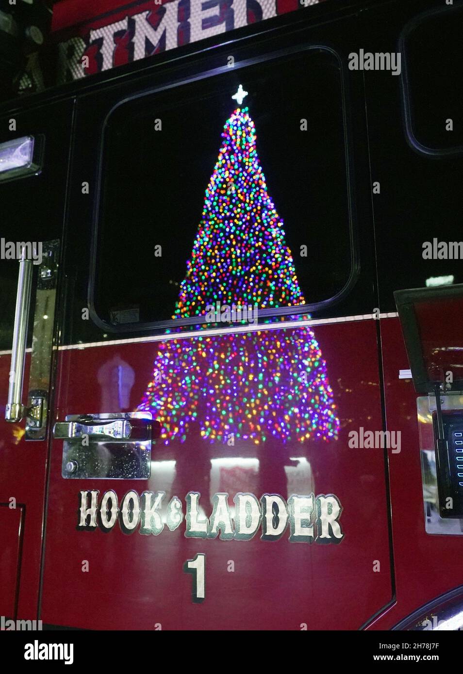 The Salvation Army Christmas tree is reflected off of St. Louis Fire ...