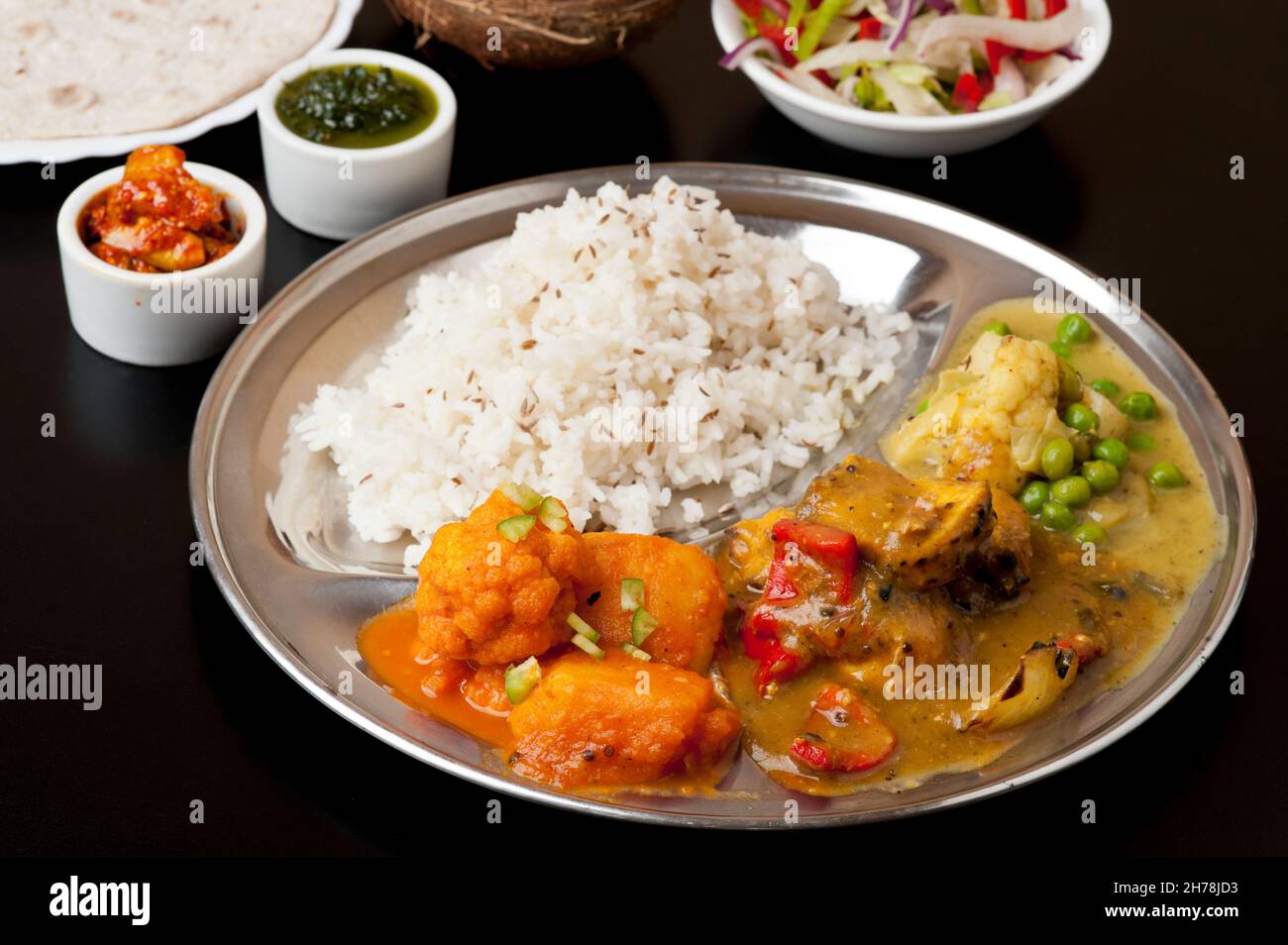 Indian Ethnical Food Thali Chicken Curry with vegetables and rice Stock ...