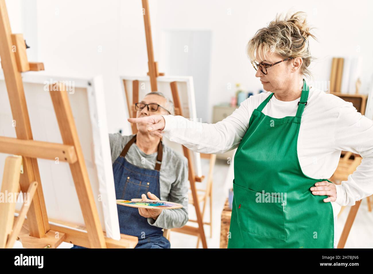 Paint teacher and student painting at art studio Stock Photo - Alamy