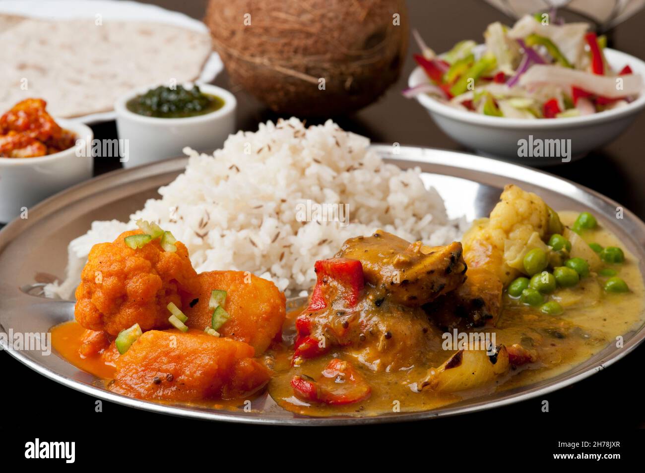 Indian Ethnical Food Thali Chicken Curry with vegetables and rice Stock ...