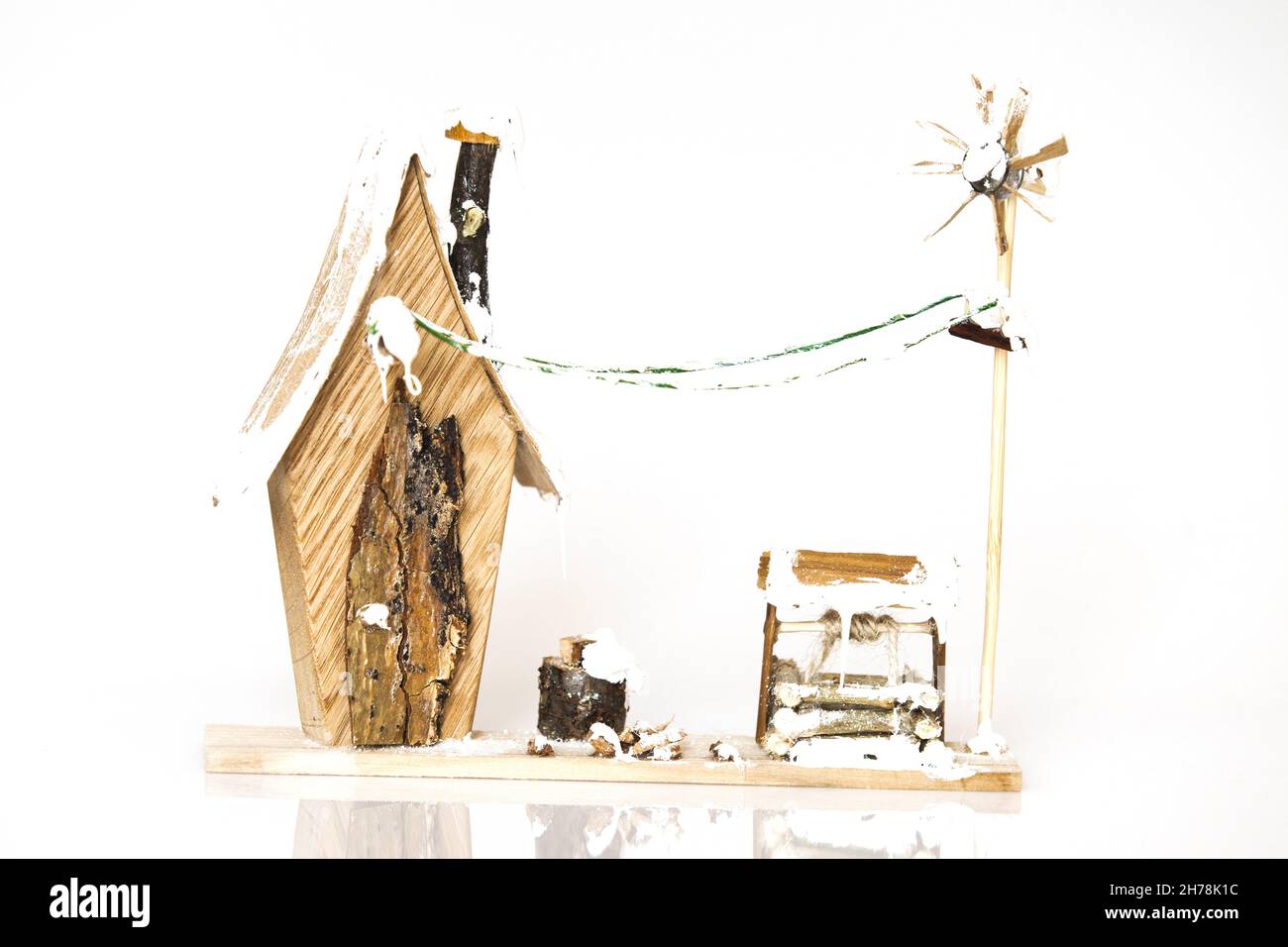 A decorative handmade wooden house toy on a white background Stock ...