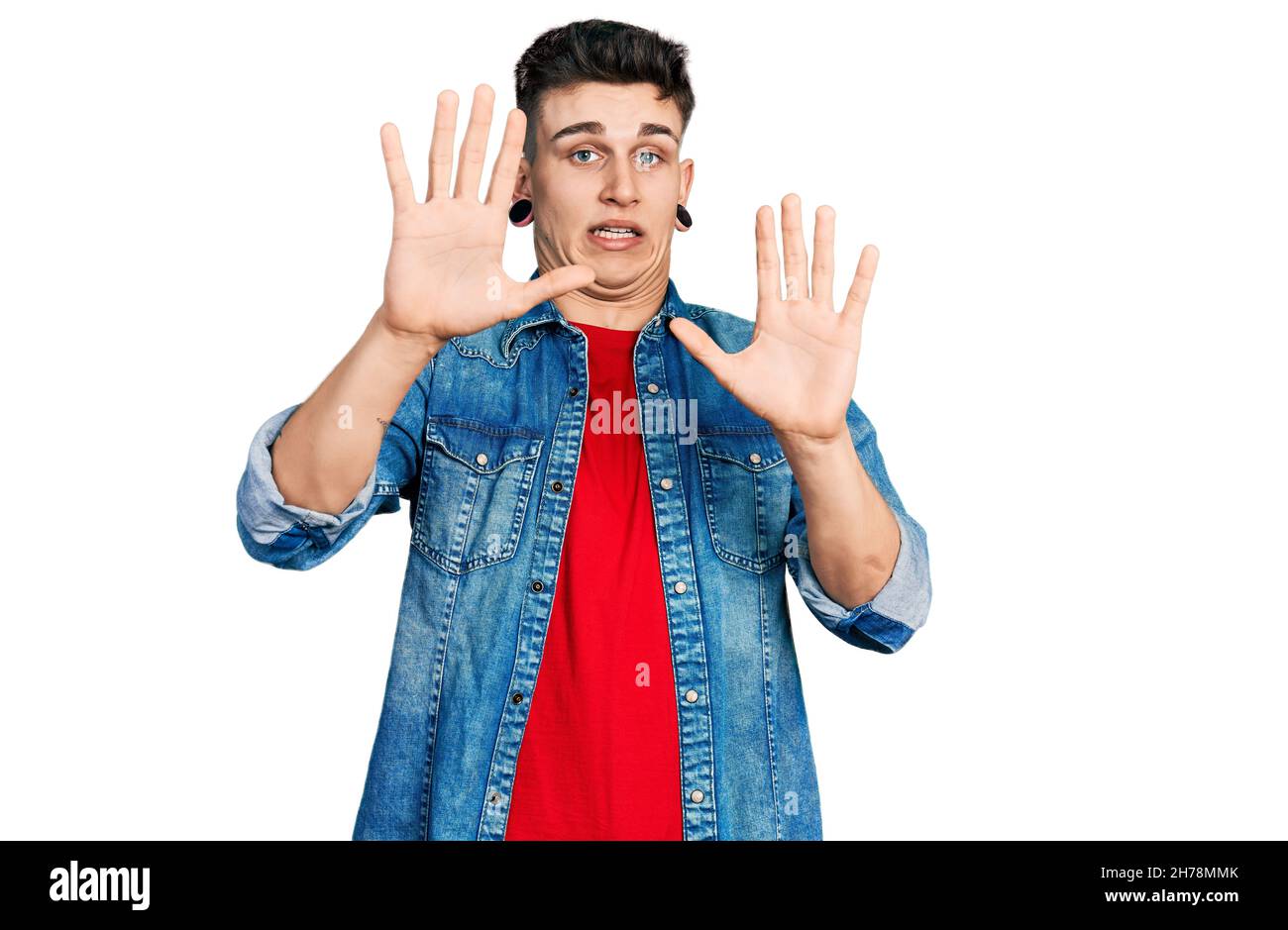 Young caucasian boy with ears dilation wearing casual denim jacket ...