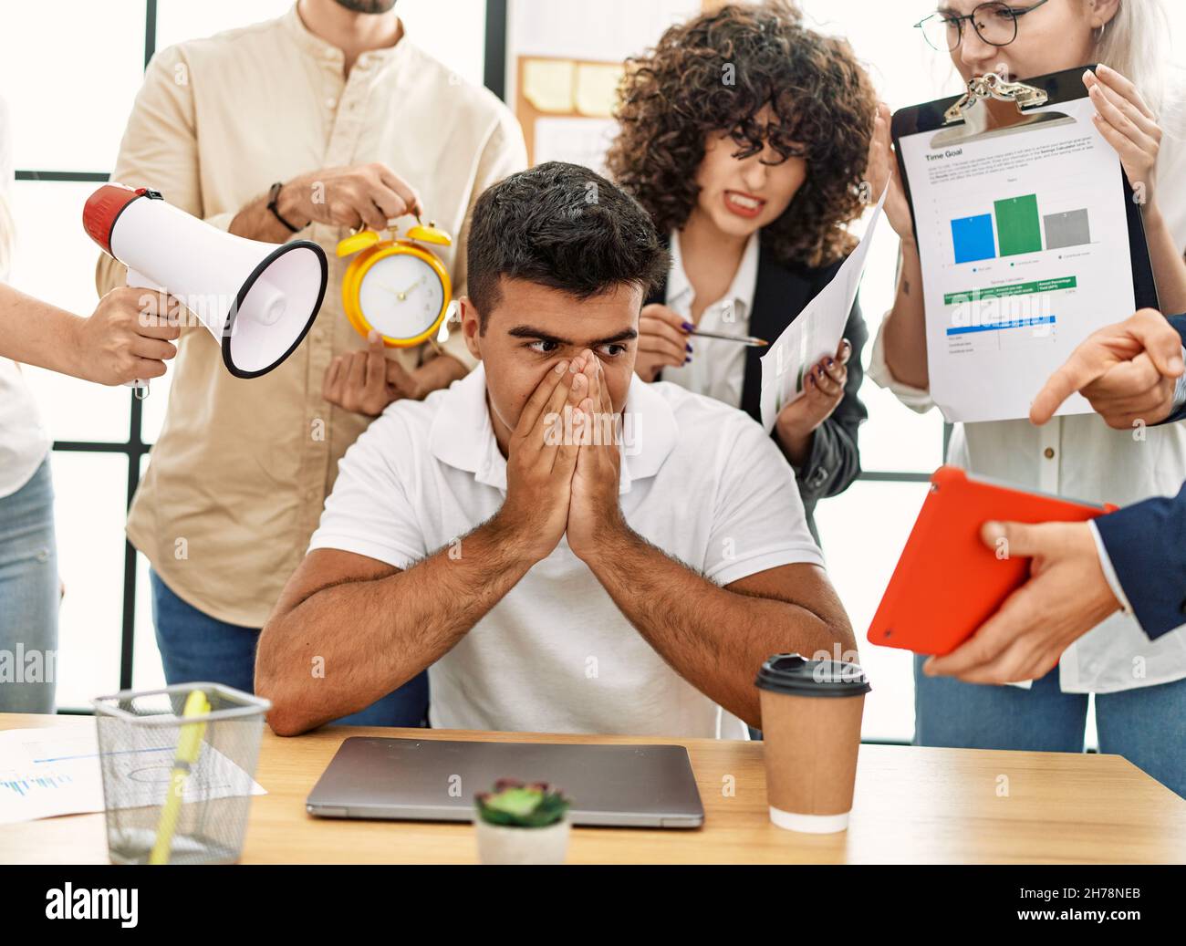 Group of business workers screaming to stressed partner at the office ...