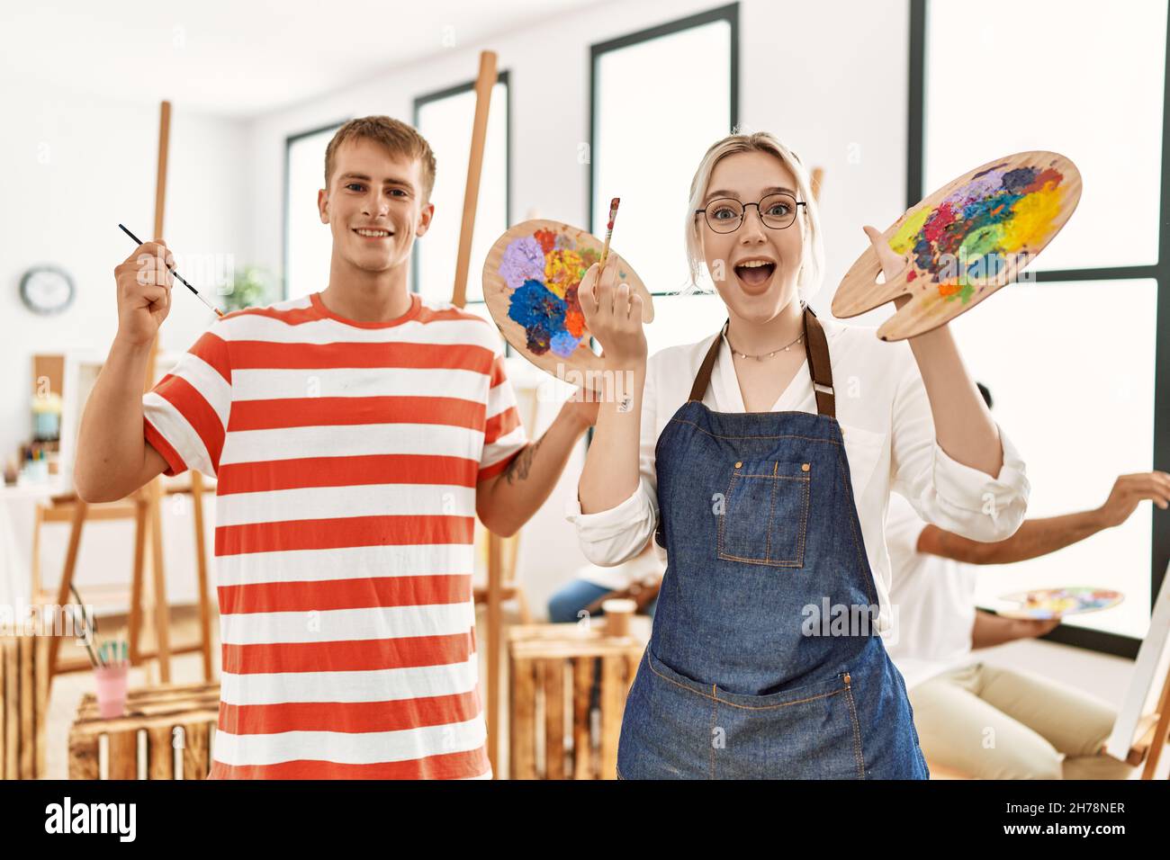 Group of people drawing at art studio. Man and woman smiling happy ...