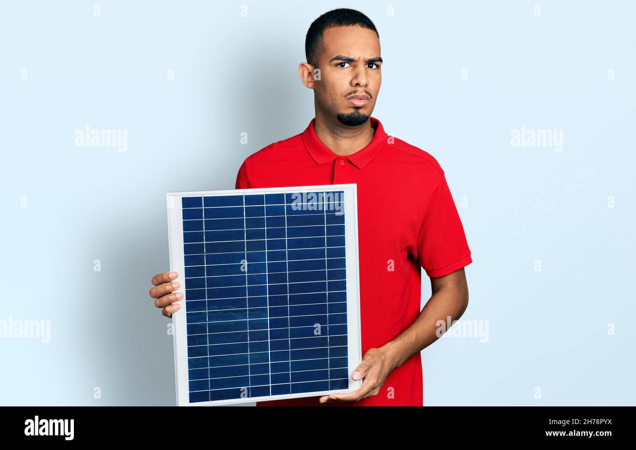 African man holding solar panel hi-res stock photography and images - Alamy
