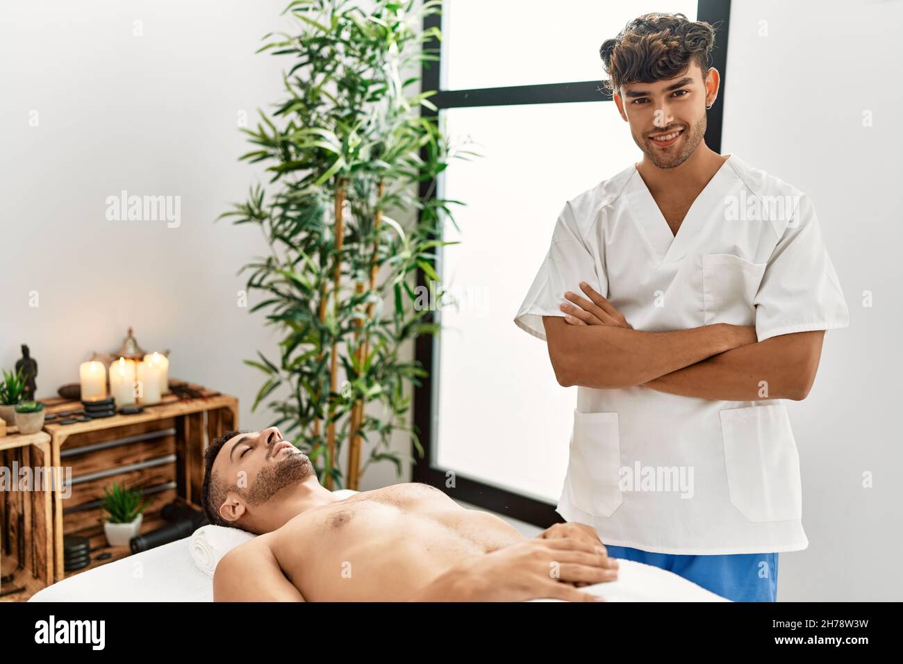 Two hispanic men therapist and patient having beauty session at beauty ...
