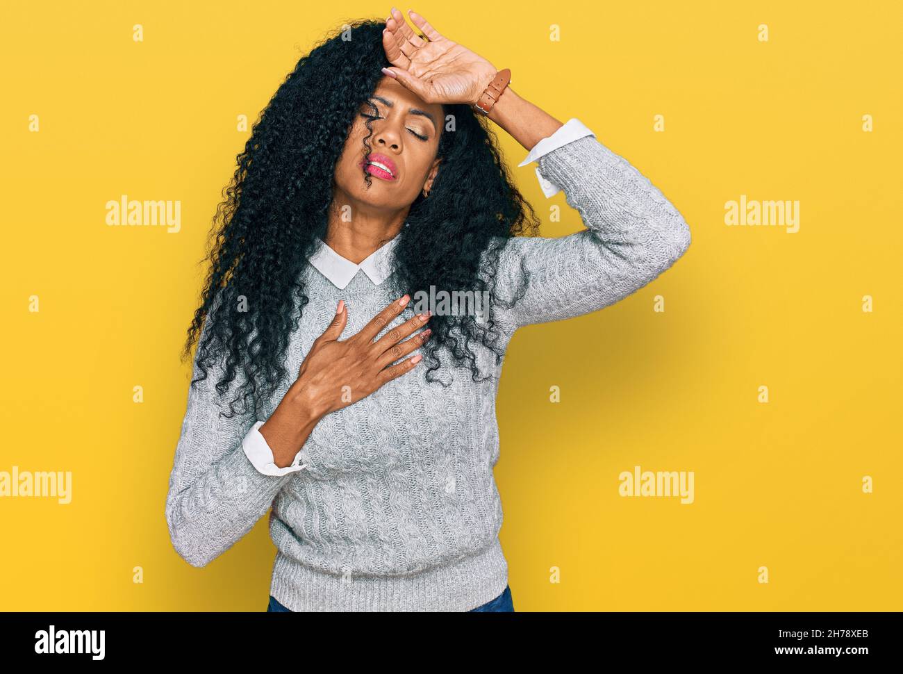 Middle age african american woman wearing casual clothes touching ...
