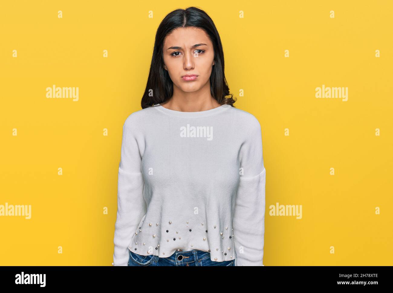 Young hispanic girl wearing casual clothes depressed and worry for ...
