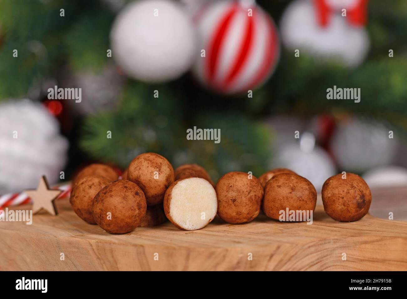 Traditional German Christmas sweets called 'Marzipankartoffeln'. Round ...