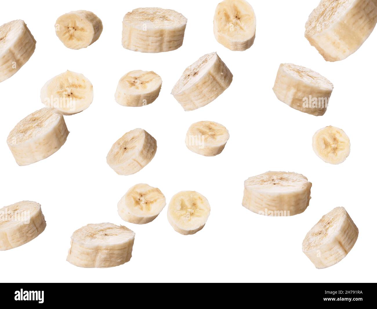 Slices of banana flying isolated on a white background Stock Photo - Alamy