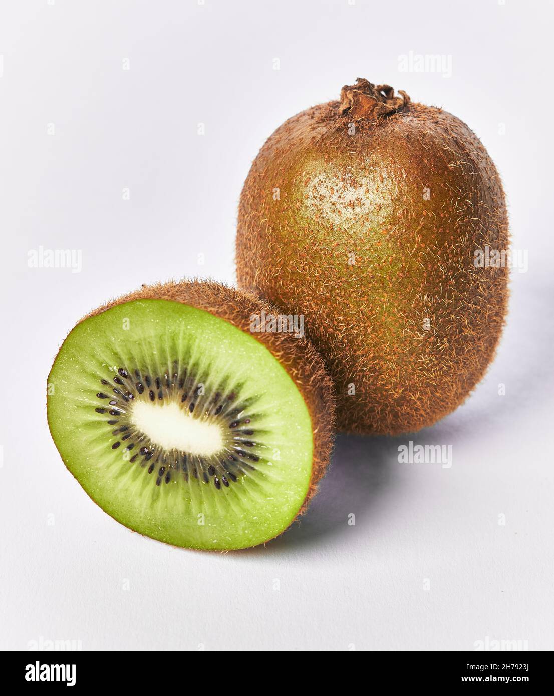 Single kiwi and slice isolated on a white background Stock Photo - Alamy