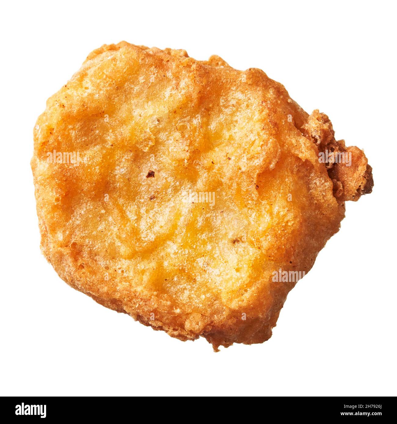 SIngle chicken nugget isolated on a white background Stock Photo - Alamy