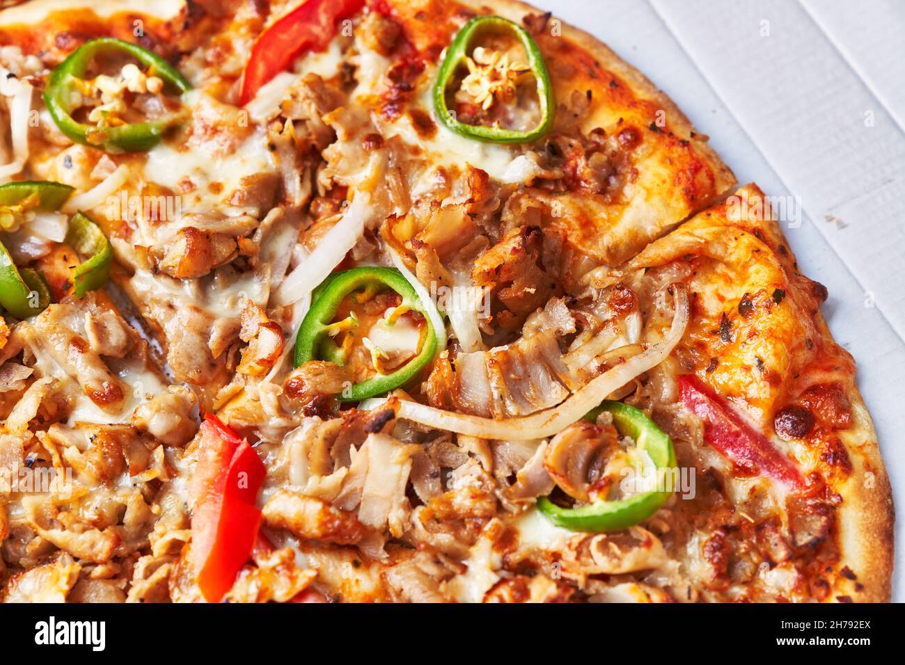 Delicious kebab italian pizza on a cardboard surface Stock Photo - Alamy