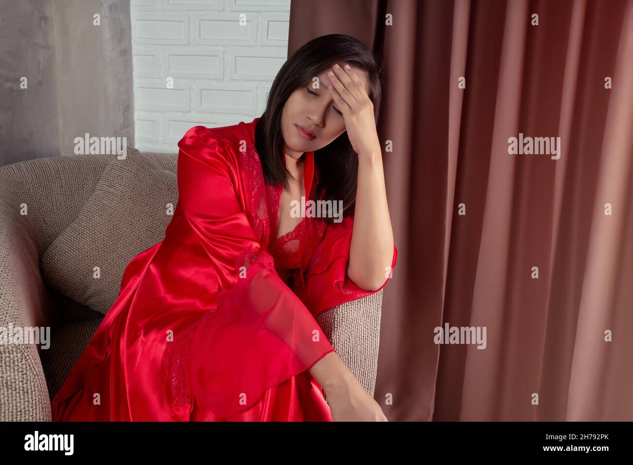 Asian woman in a red satin nightgown and red long full length robe with ...