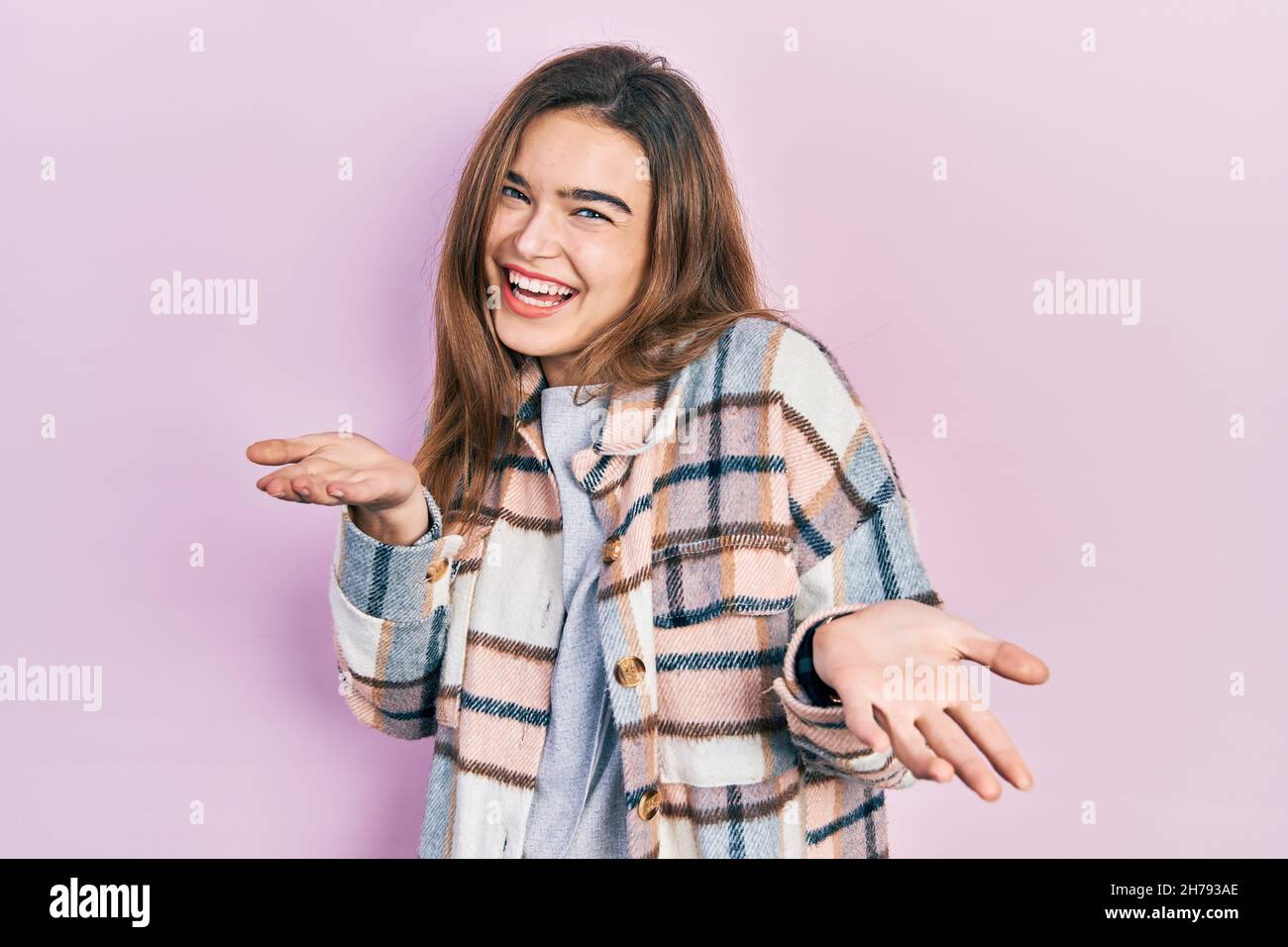 Young caucasian girl wearing casual clothes smiling cheerful offering ...
