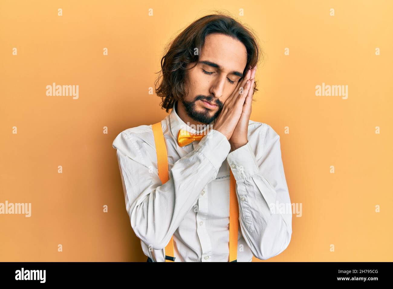 Young hispanic man wearing hipster elegant look sleeping tired dreaming ...