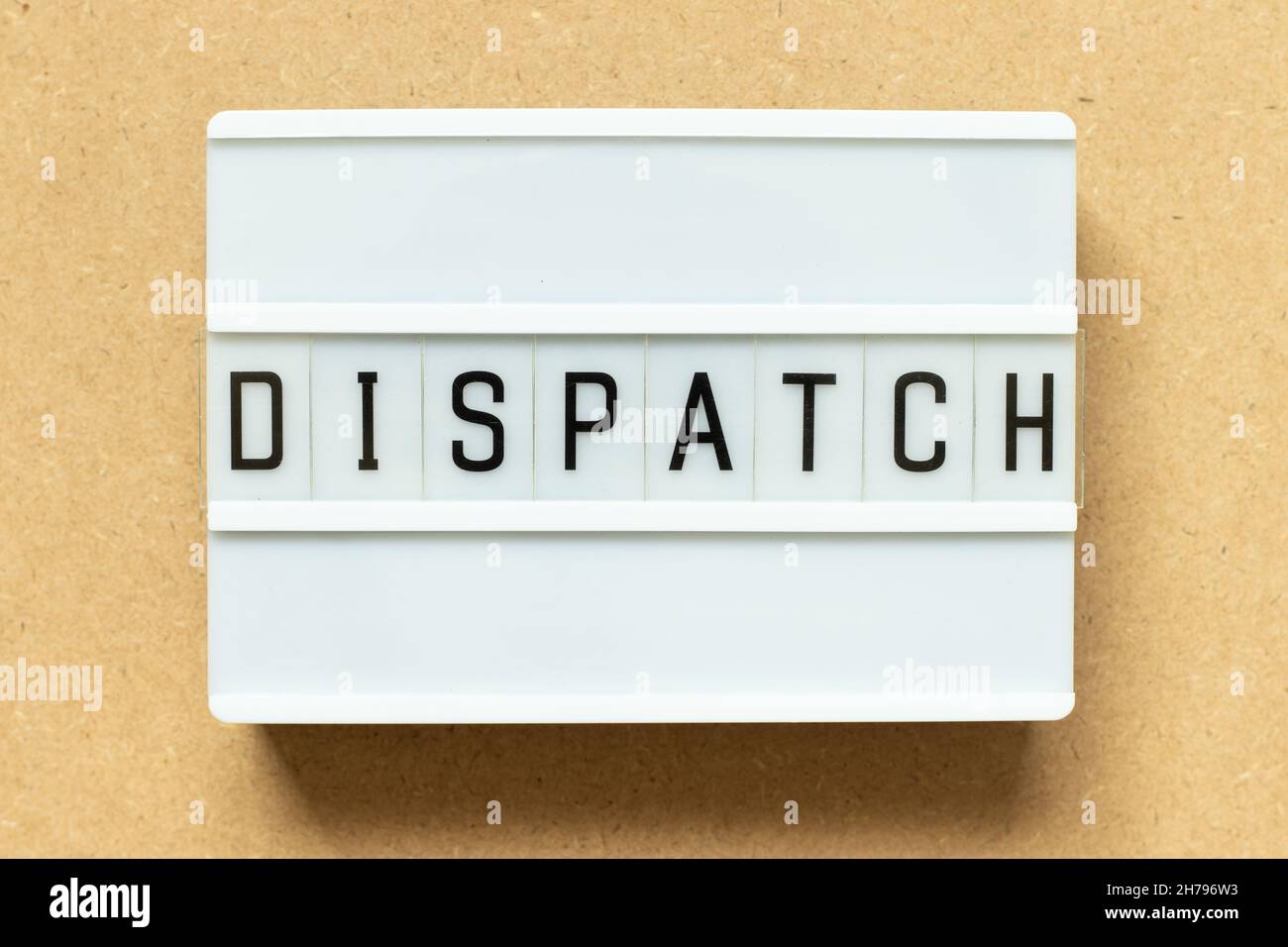 Lightbox with word dispatch on wood background Stock Photo - Alamy