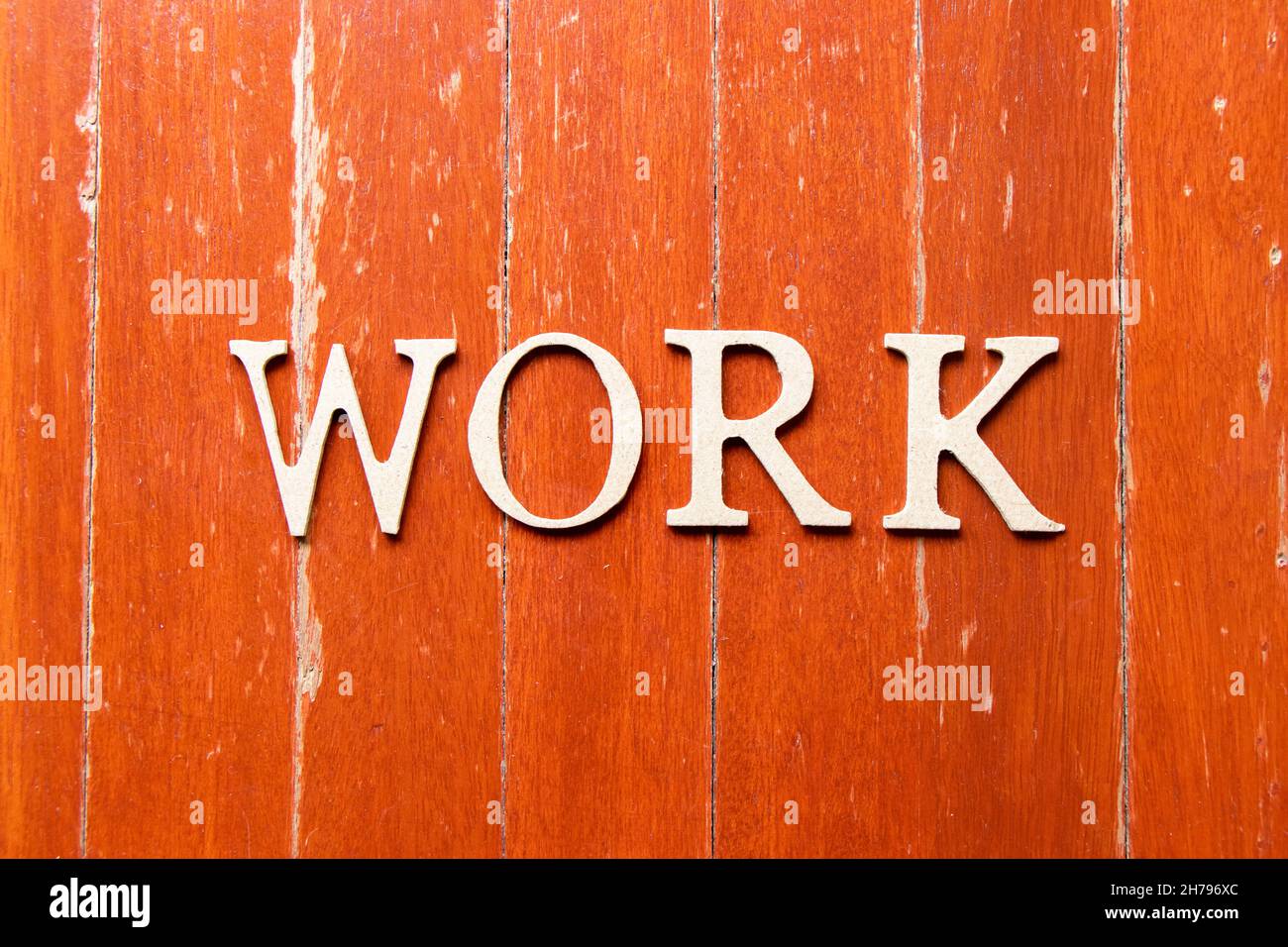 Alphabet letter in word work on old red color wood plate background ...