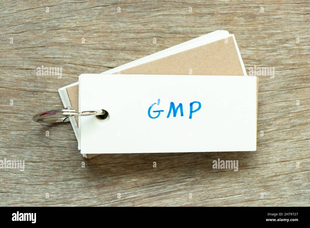 Flash card with handwriting word GMP (Abbreviation of good ...