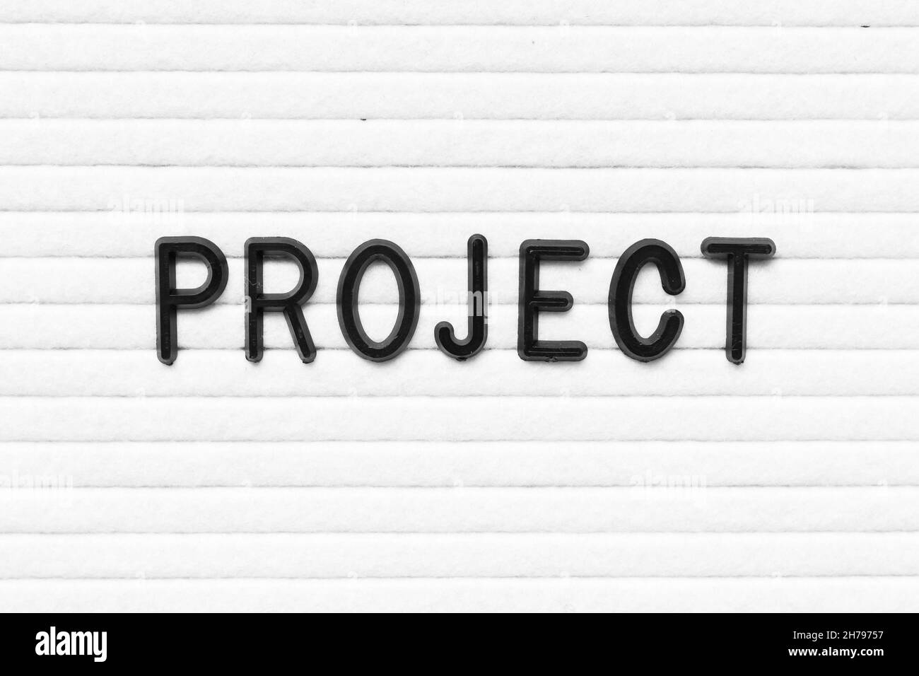 Black letter in word project on white felt board background Stock Photo ...