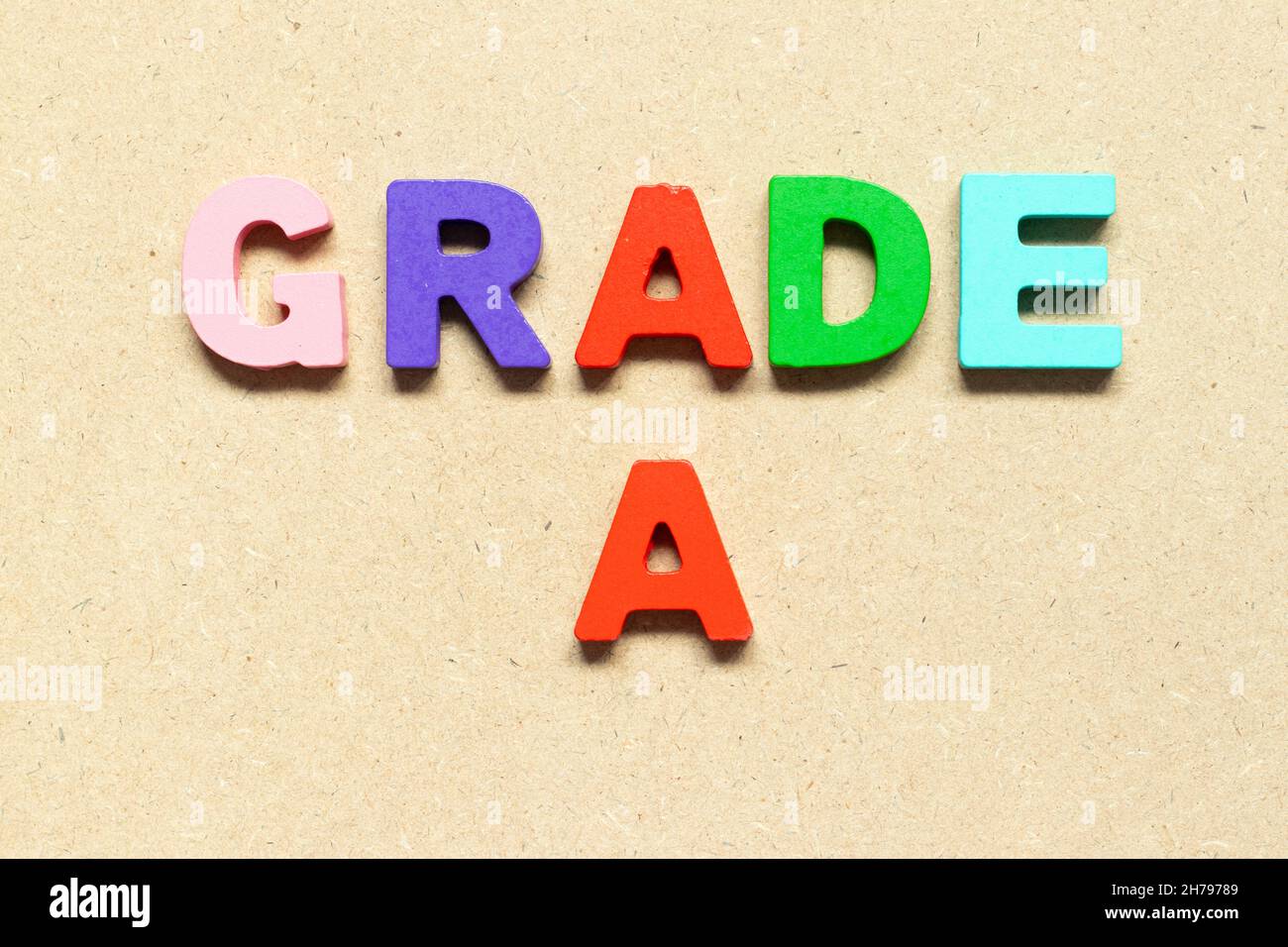 Color alphabet letter with word grade A on wood background Stock Photo ...