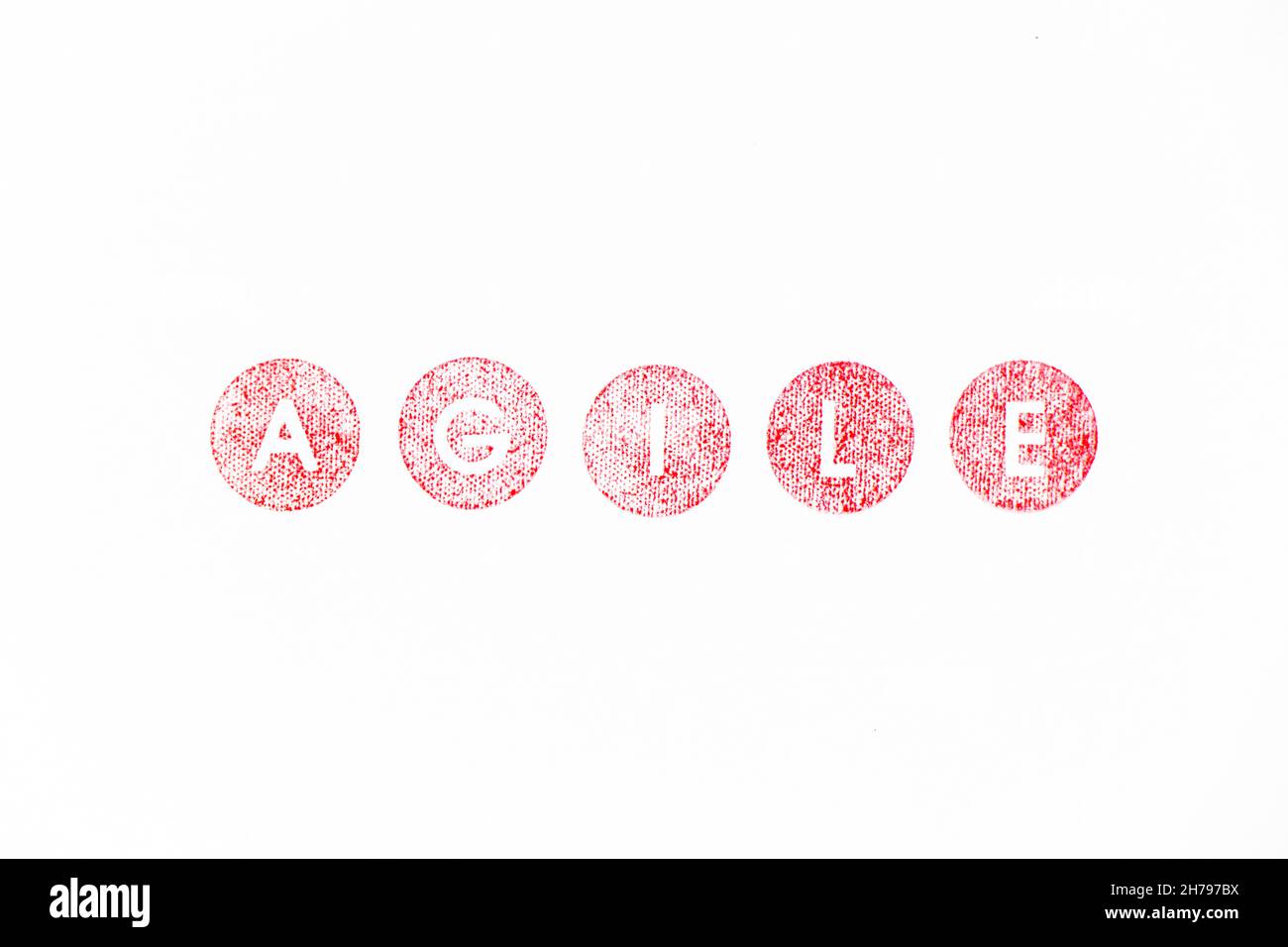 Red color rubber stamp in word agile on white paper background Stock ...