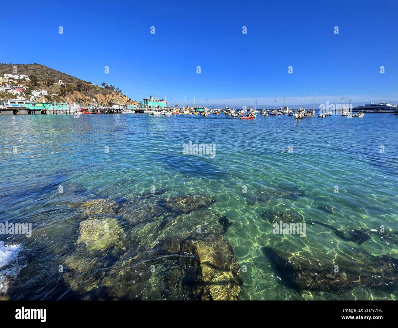 A tranquil scenery of a port in the clear azure ocean in sunlight Stock ...