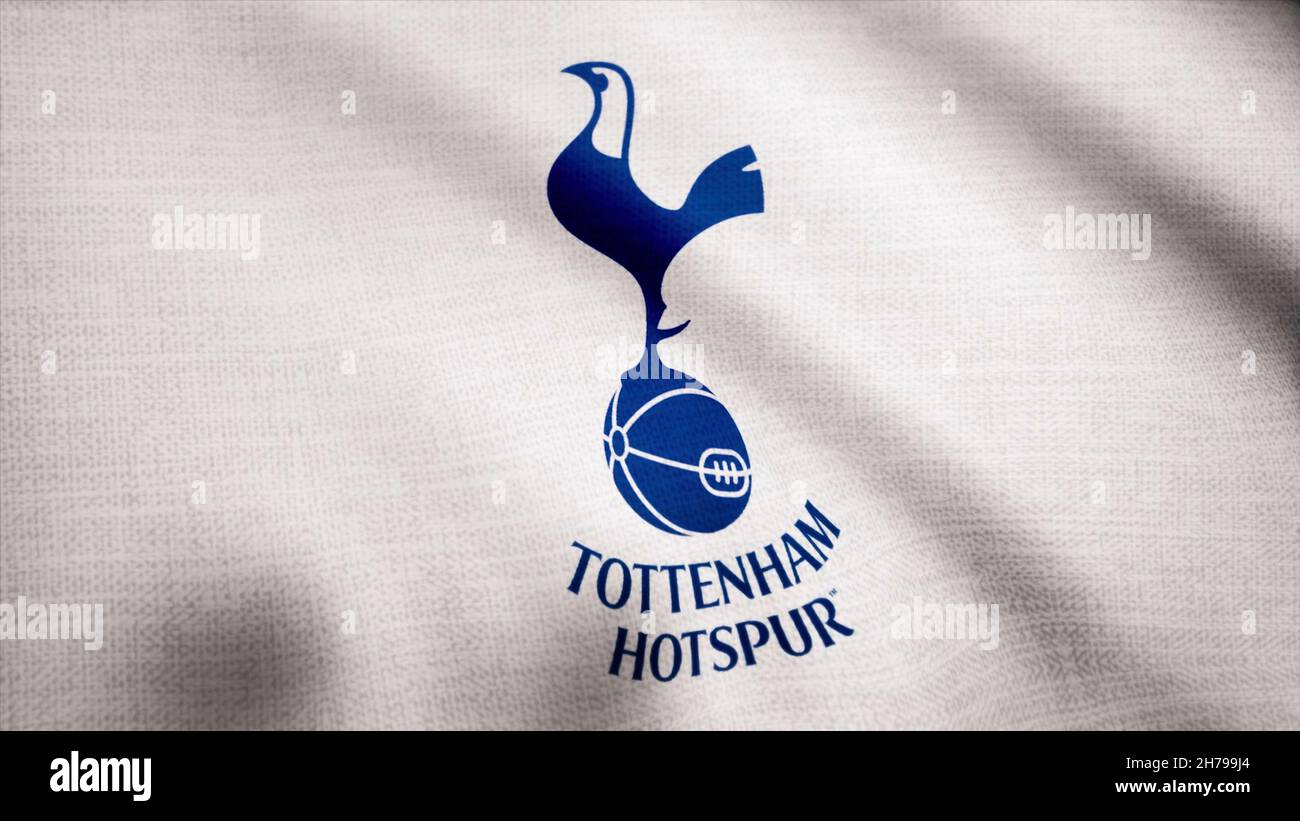 Close-up of waving flag with FC Tottenham Hotspur football club logo ...