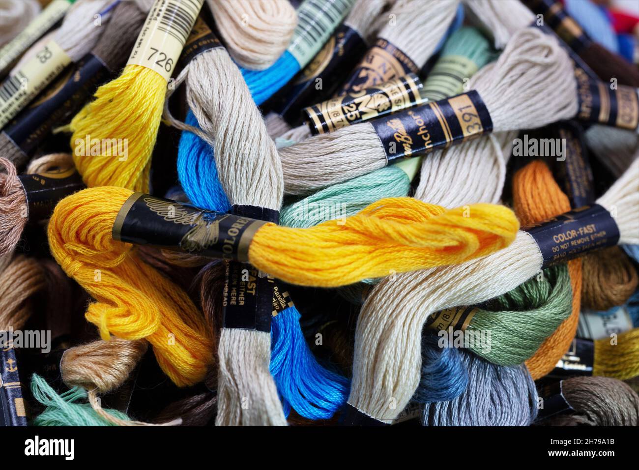 A jumbled pile of embroidery threads of different colors Stock Photo ...