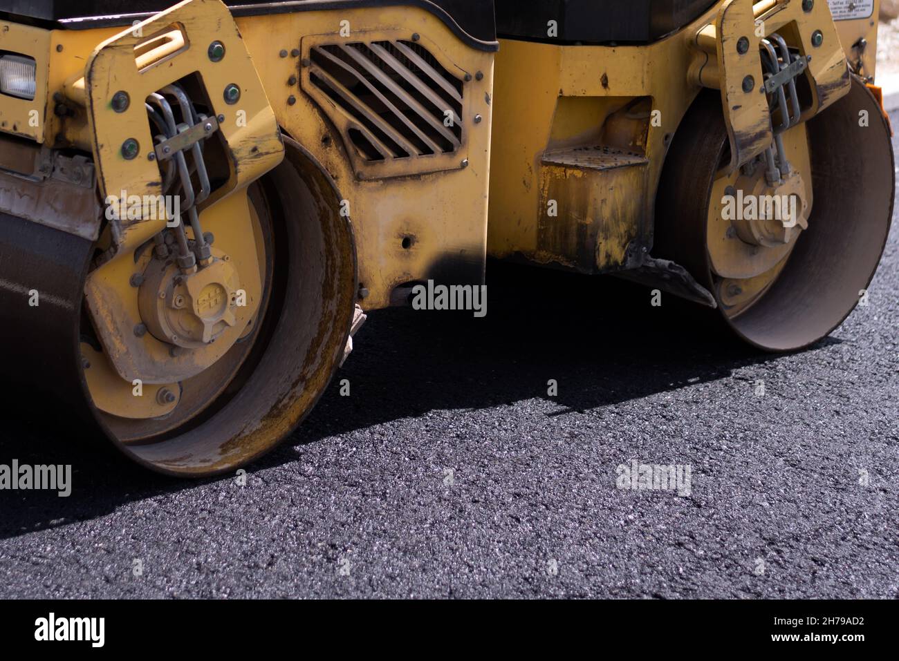 Urban road asphalting works. Asphalt paving. Paver machine and road ...